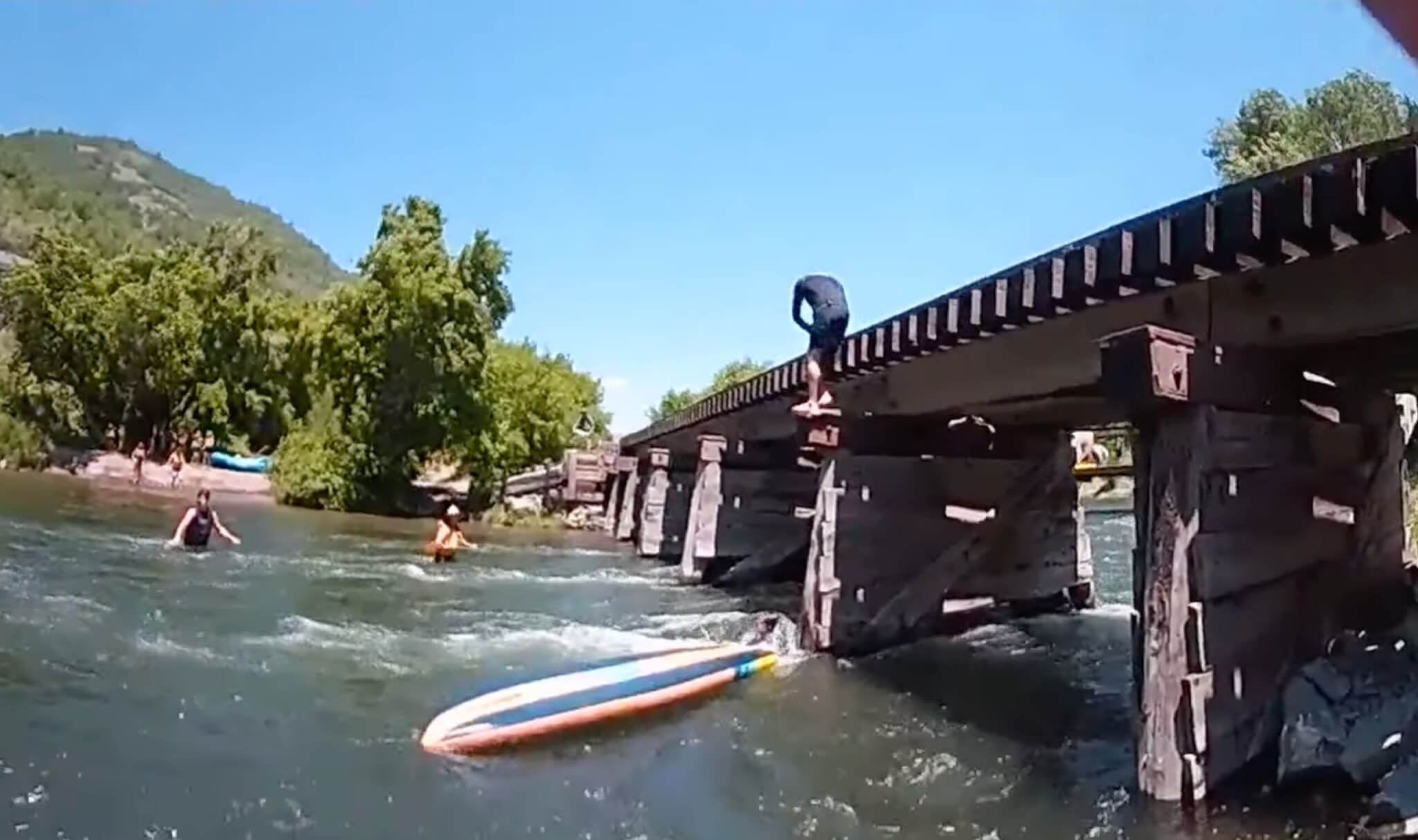 Paddleboarder rescued after becoming trapped under bridge on Provo ...